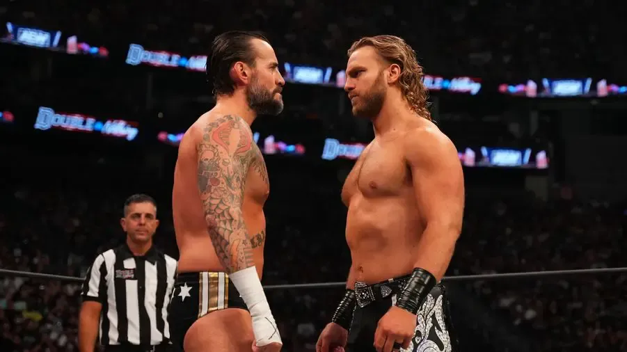 Report: CM Punk Suggests Hangman Page Was "Shooting" On Him At AEW ...